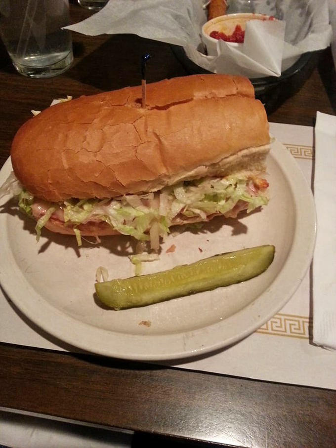 Behold the Italian hoagie—a architectural marvel of meat, cheese, and shredded lettuce that requires both hands and possibly a nap afterward.