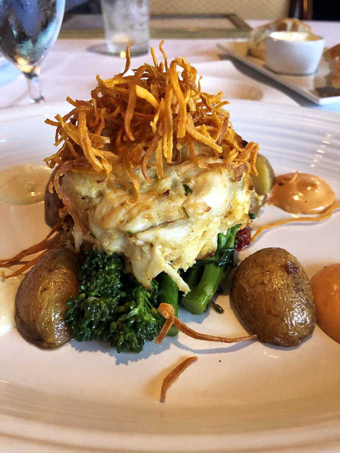 The Jumbo Lump Crab Cake arrives like edible architecture—stacked with precision, surrounded by artistic sauce swirls, and crowned with ingredients that make Pennsylvania proud.