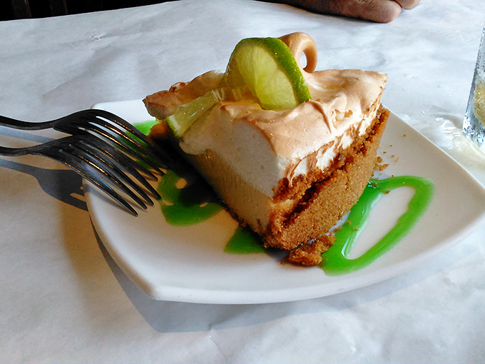 The key lime pie that launched a thousand road trips—tangy, sweet, and topped with a lime slice that's basically saying, "Yes, I'm worth the drive."