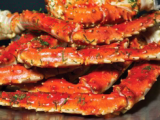 King crab legs so substantial they look like they've been lifting weights underwater—oceanic bodybuilders ready for their close-up.