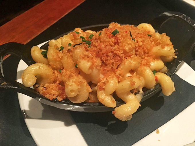 Mac and cheese for grown-ups—where pasta meets decadence in a cast-iron skillet. The crispy top layer is worth fighting your dining companion for.