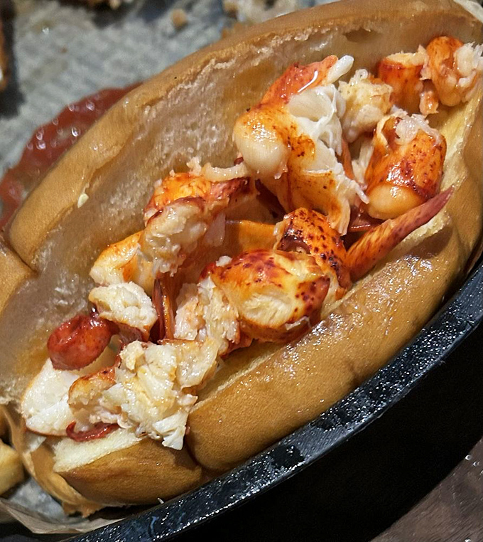 Lobster roll heaven! Sweet, tender chunks of lobster nestled in a perfectly toasted bun—the kind of sandwich that makes you consider relocating to New England.