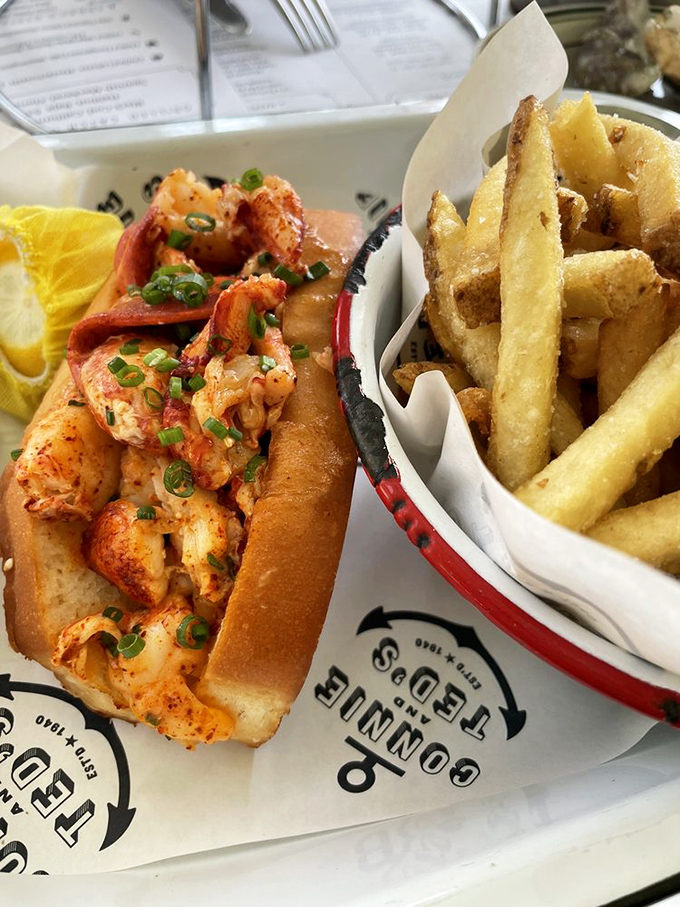 The lobster roll that launched a thousand road trips—sweet meat, buttery roll, and fries that deserve their own fan club.