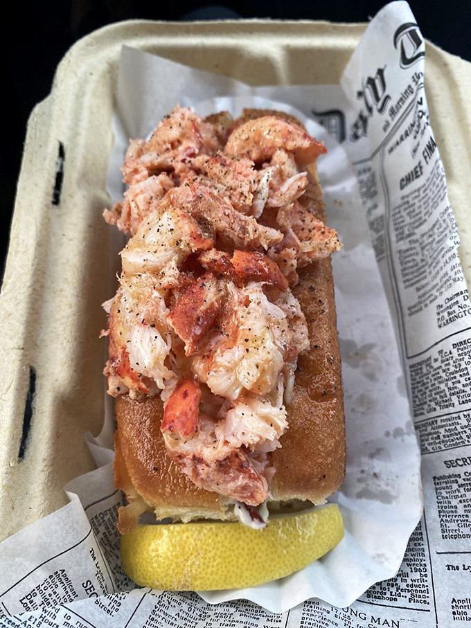 Behold the star of the show – chunks of Maine lobster nestled in a perfectly toasted split-top roll. Simplicity that speaks volumes.