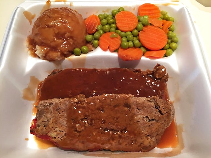 Comfort on a foam plate. This meatloaf with rich gravy and vibrant vegetables wouldn't be out of place at grandma's Sunday dinner table.