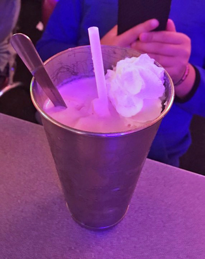 The milkshake so thick it defies gravity—topped with whipped cream that stands at attention. This isn't a drink; it's dessert with a straw as an optimistic suggestion.