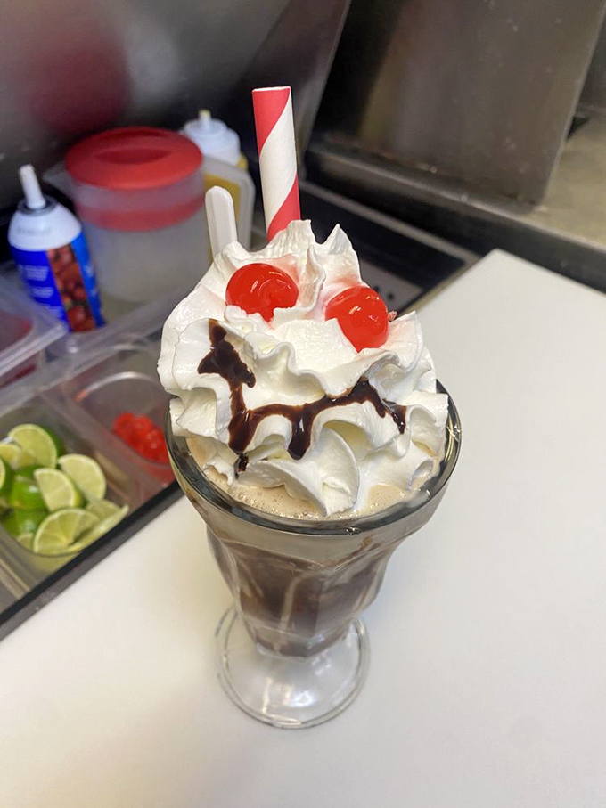 A milkshake so thick it demands respect and patience—the whipped cream mountain on top is just showing off.