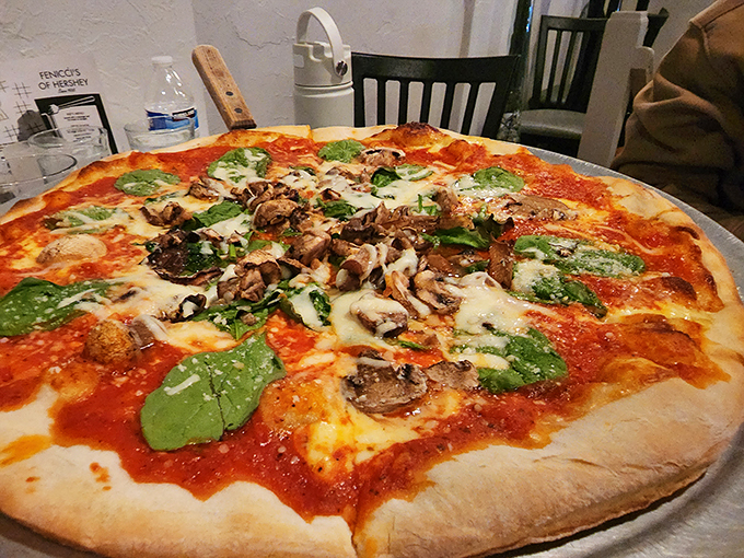 Pizza that demands to be photographed before eaten. Those fresh basil leaves aren't just garnish—they're little green flags of flavor victory.