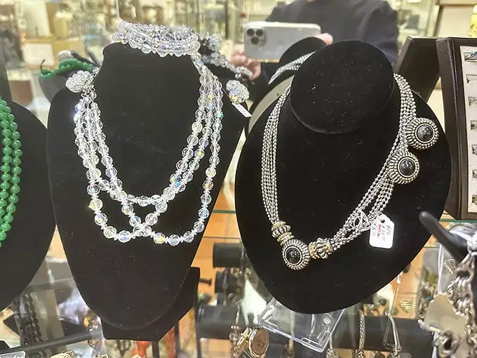 Crystal beads and ornate silver settings—these necklaces weren't just accessories but statements, worn during eras when "going viral" meant catching the flu.