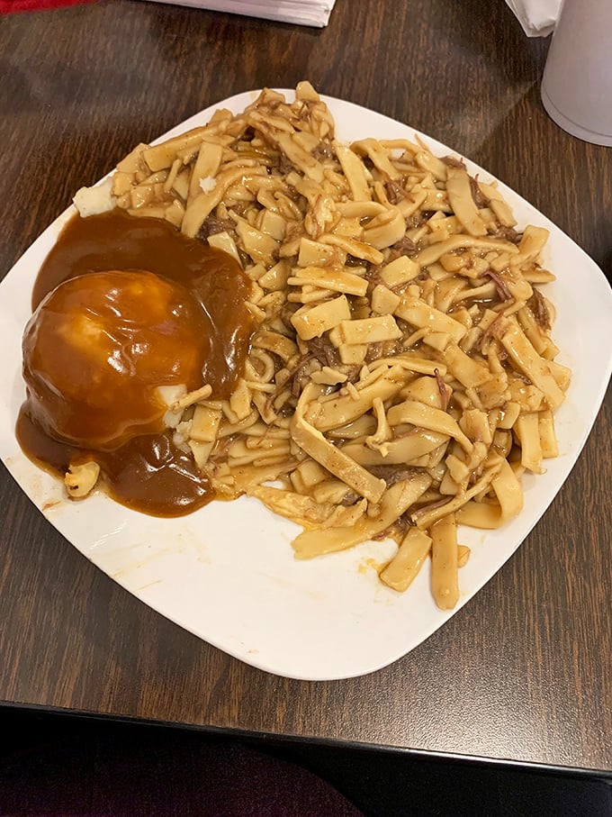 Comfort food doesn't get more comforting than this – homestyle noodles and mashed potatoes smothered in gravy that could solve world peace.