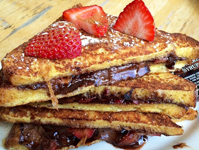 French toast that makes you want to write thank-you notes to whoever invented Nutella. Those strawberries aren't just garnish—they're co-stars.