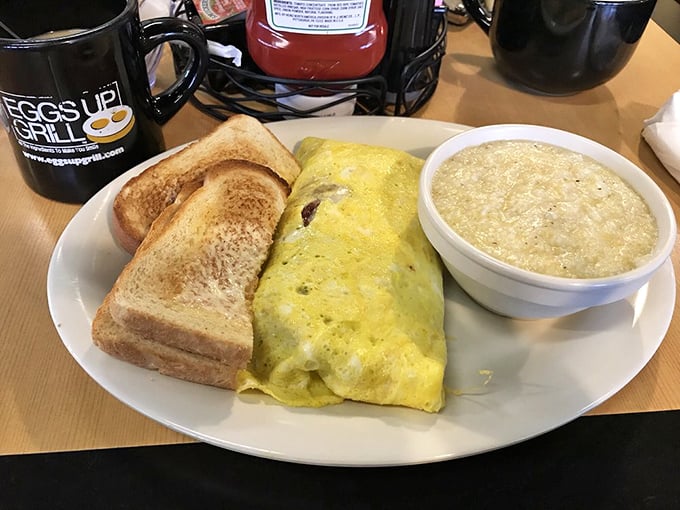 The holy trinity of Southern breakfast: a fluffy omelet, buttery toast, and a bowl of grits. Name a more perfect morning trio—I'll wait.
