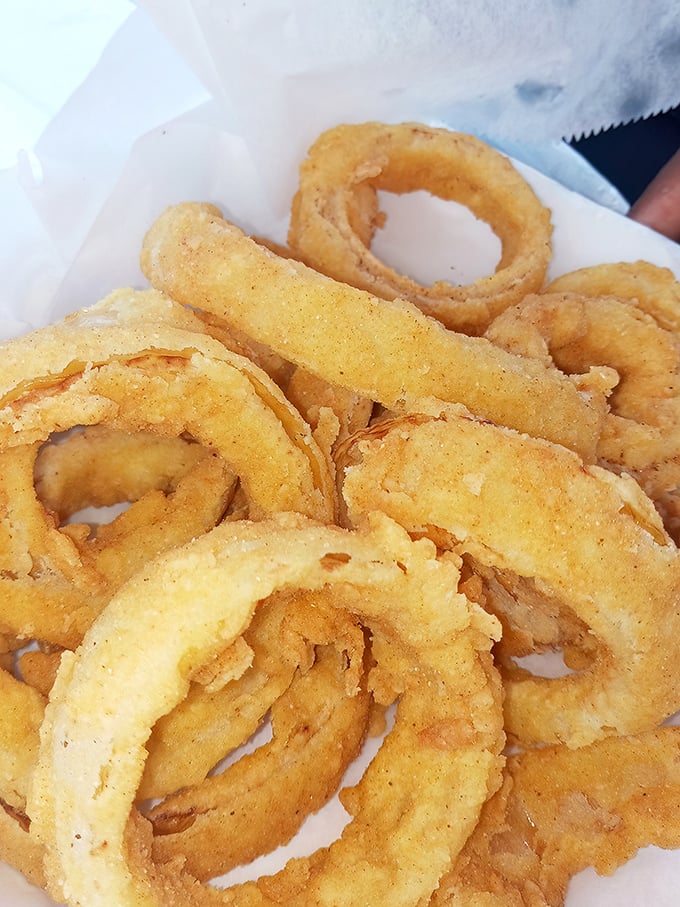 These onion rings aren't just fried—they're transformed. Crispy, golden halos that make you wonder why vegetables ever bothered growing any other way.