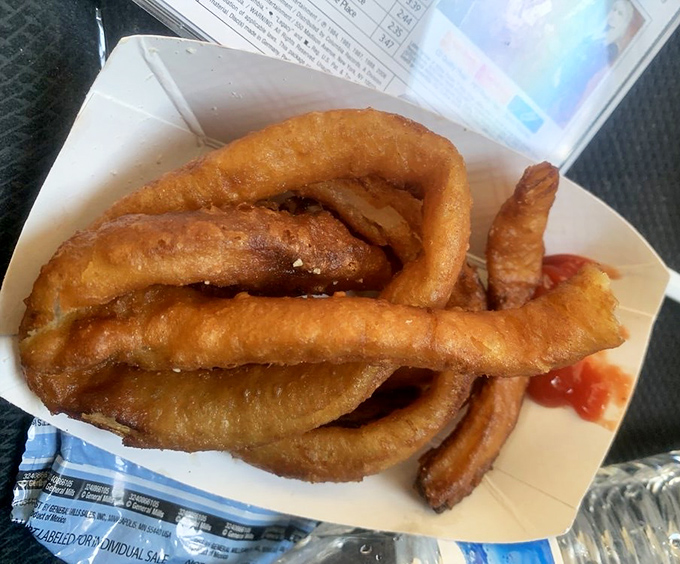 These aren't just onion rings; they're crispy, golden bracelets of joy that have been perfected through decades of deep-frying dedication.