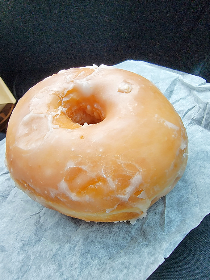 Behold the glazed donut in its purest form—the little black dress of the pastry world, timeless and perfect without unnecessary frills.