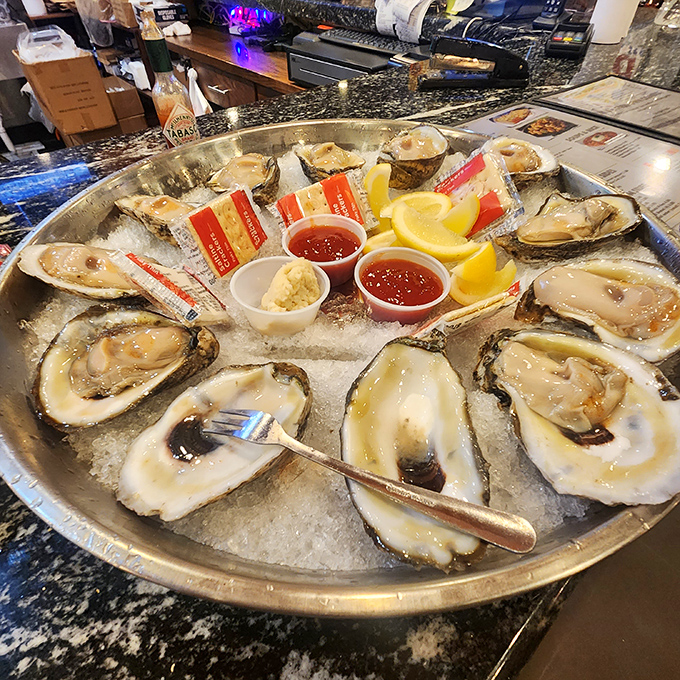 Fresh oysters on ice—ocean jewels waiting for a squeeze of lemon and a moment of appreciation before their brief, glorious journey from plate to palate.