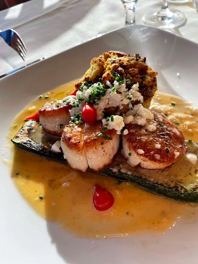 These scallops aren't just seared—they're transformed into buttery medallions of oceanic perfection, resting on a zucchini throne worthy of Neptune himself.