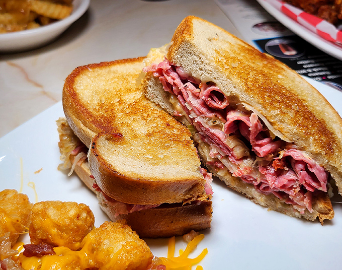 A proper Reuben should require both hands and at least three napkins. This beauty has layers like a good mystery novel—each one more satisfying than the last.