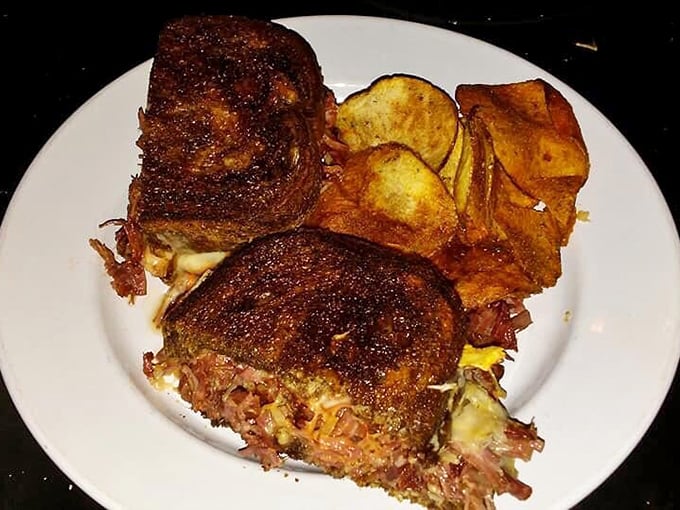 Sandwich architecture at its finest—this patty melt's crispy exterior gives way to melty, beefy bliss that demands both hands.