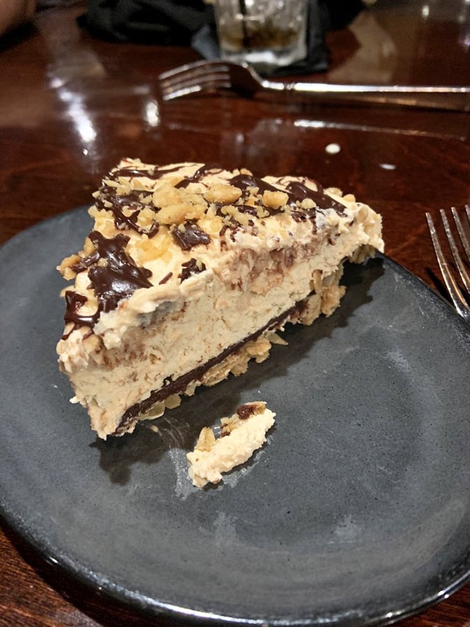 Not all heroes wear capes—some wear chocolate drizzle and crushed peanuts. This peanut butter pie could make even the most dignified diner lick the plate.