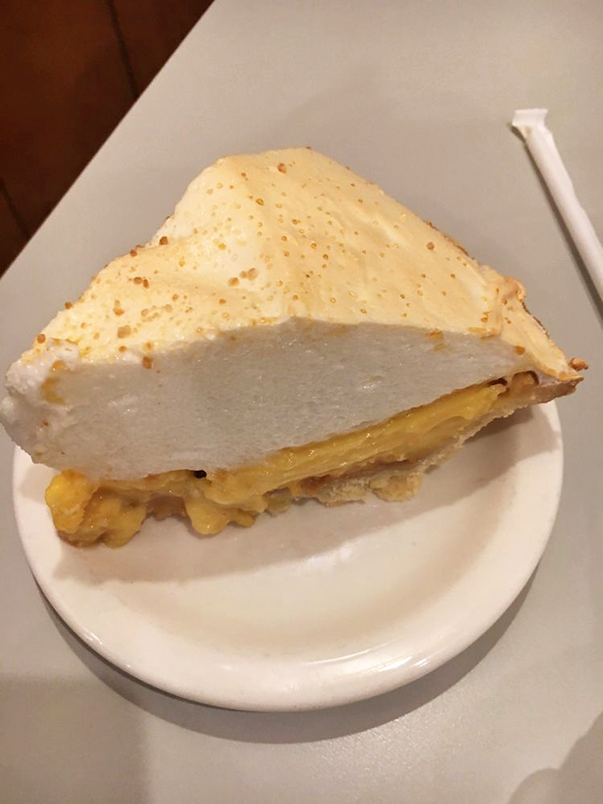 This isn't just pie—it's a towering monument to the marriage of peanut butter and cream that would make Elvis weep with joy.