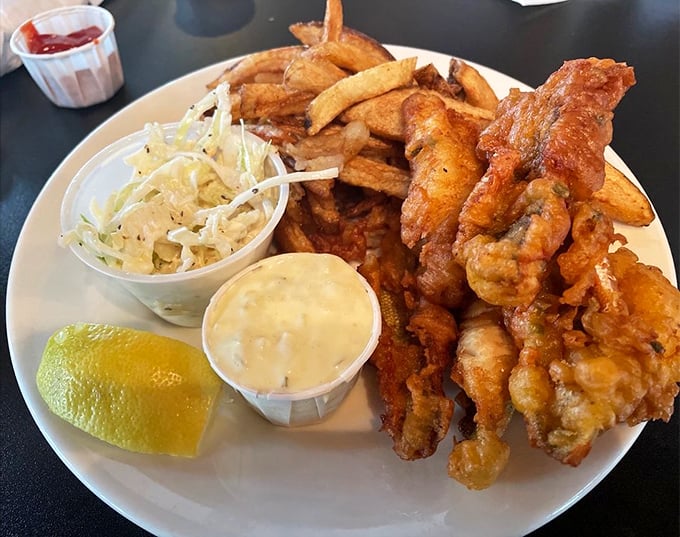 Lake Erie perch gets the royal treatment: lightly breaded, perfectly fried, and served with the holy trinity of coleslaw, fries, and tartar sauce.