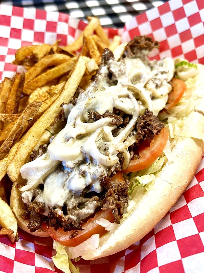 This Philly cheesesteak with hand-cut fries isn't just lunch—it's therapy. The melted cheese blanket is doing emotional support work that would cost $200 an hour elsewhere.