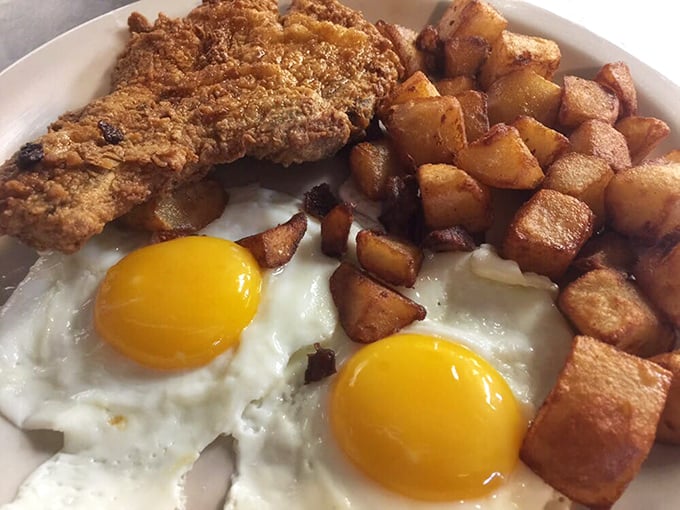 Country fried pork chop with the golden crust of champions. The kind of meal that demands a post-dinner nap and zero regrets.