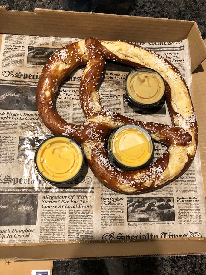 The Bavarian pretzel isn't just big, it's ambitious. Three dipping sauces stand ready for your dunking pleasure—this is carb architecture at its finest.