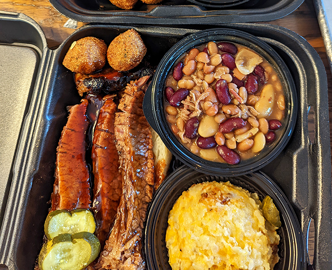 Baked beans mingling with perfectly smoked meats and corn casserole – proof that side dishes deserve just as much respect as the main event.