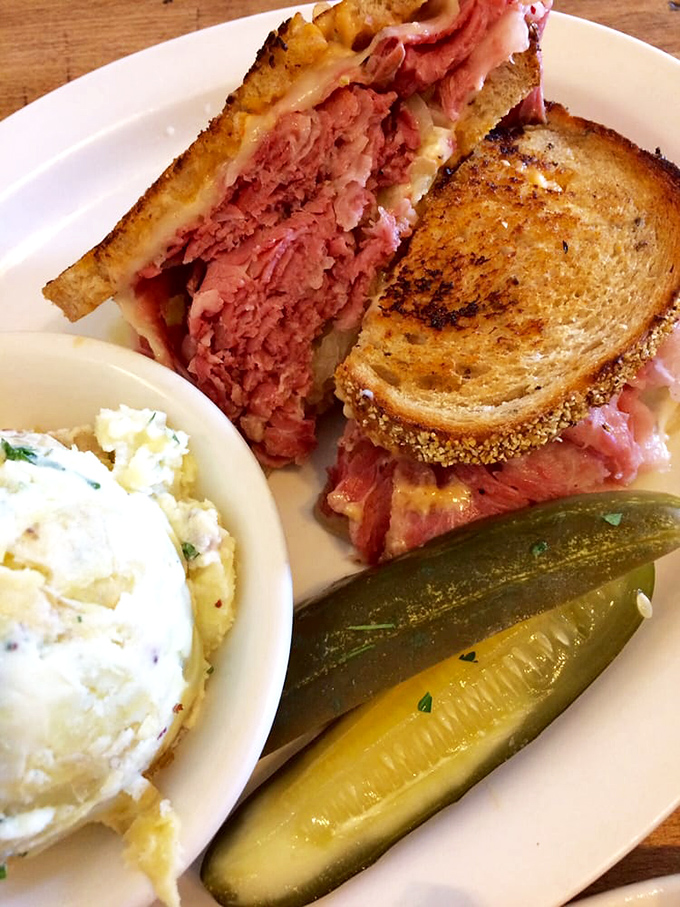 This Reuben isn't just a sandwich; it's a masterclass in the art of perfect balance – salty, tangy, creamy, and crispy in every bite.
