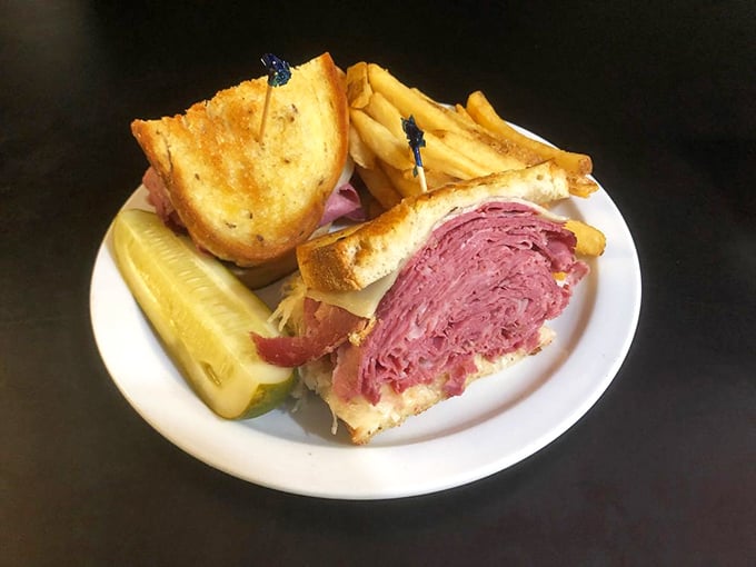 The Reuben—where corned beef, sauerkraut, Swiss, and Russian dressing perform a flavor symphony that would make Mozart jealous.