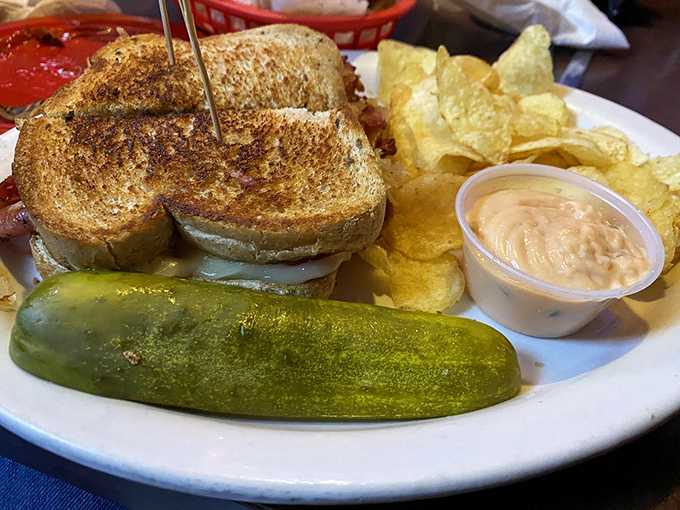 A proper Reuben should require strategic planning before each bite. This one comes with its own pickle spear sentinel standing guard.