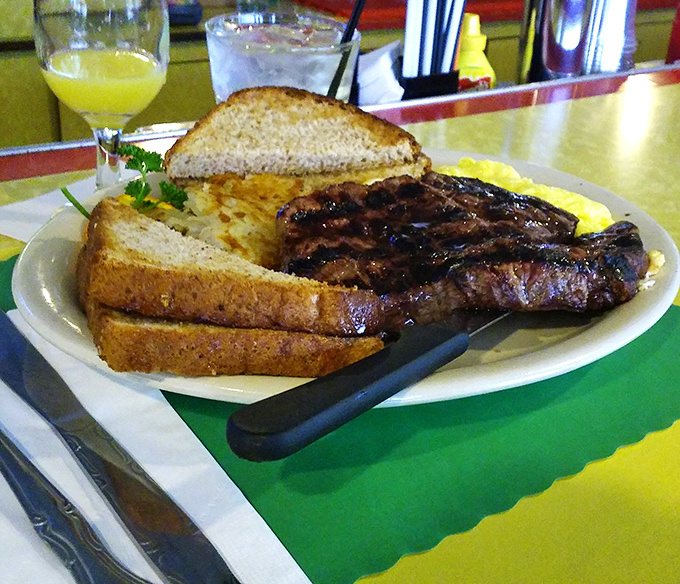 Breakfast of champions: a perfectly grilled steak alongside golden eggs and toast—the kind of hearty plate that fuels Wisconsin's hardworking spirit.