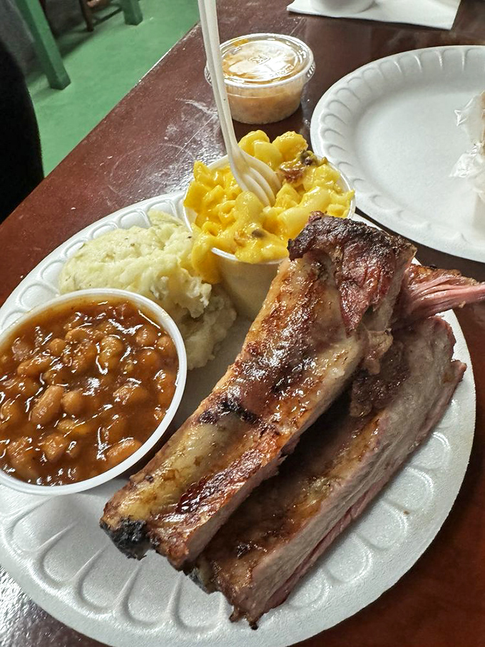 Ribs, mac and cheese, and beans – a plate so perfect it should be hanging in the Comfort Food Hall of Fame.