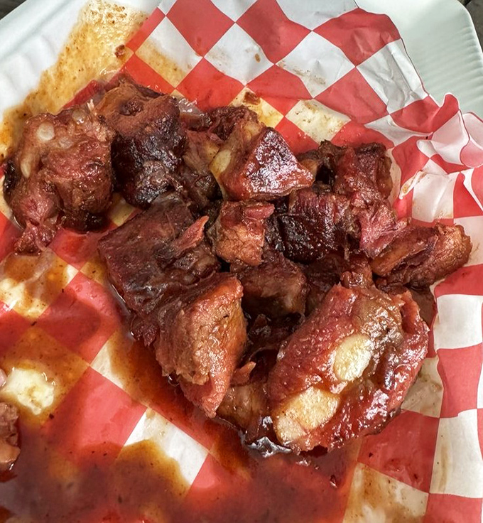 These rib tips glisten with smoky perfection, proving that sometimes the best cuts are the most underrated ones.