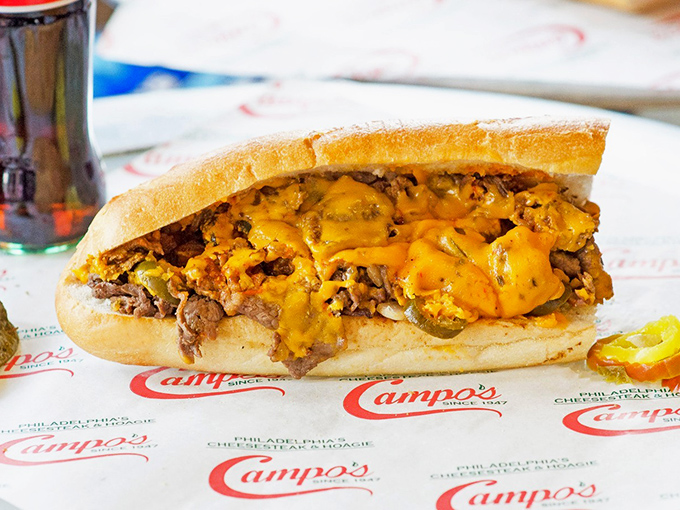 Thinly sliced ribeye, perfectly grilled and folded into that iconic Amoroso roll – this isn't just lunch, it's a Philadelphia rite of passage.