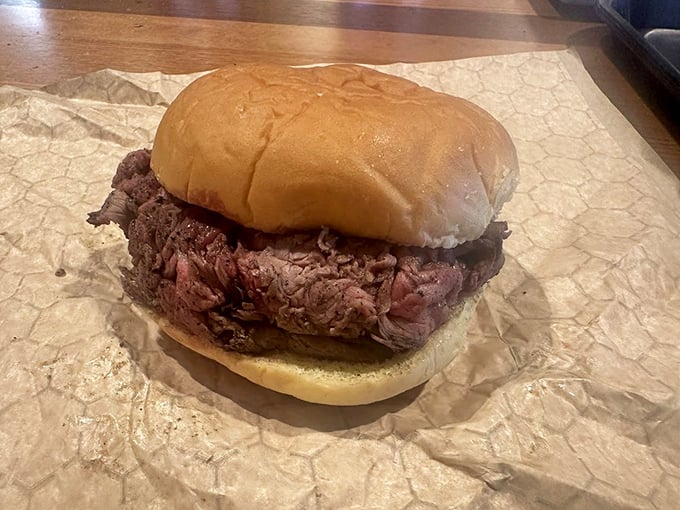 The star of the show: paper-thin slices of rosy pit beef piled impossibly high on a humble roll. Simplicity that somehow borders on the profound.