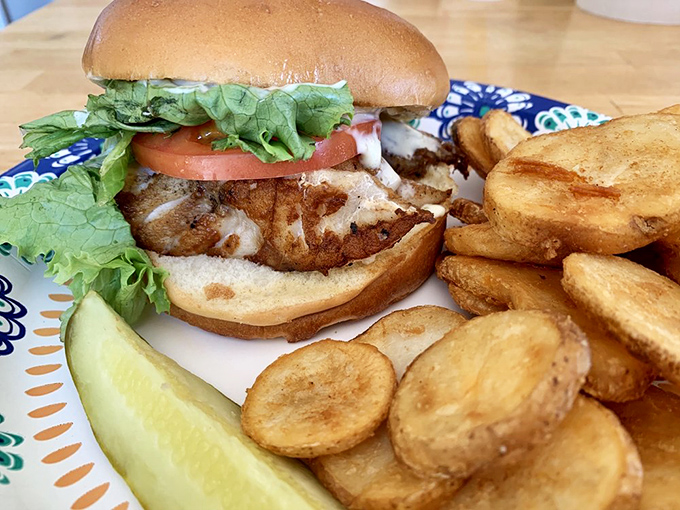 A proper fish sandwich isn't just lunch—it's an engineering marvel of crispy fish, fresh vegetables, and toasted bun that somehow defies the laws of sandwich physics.