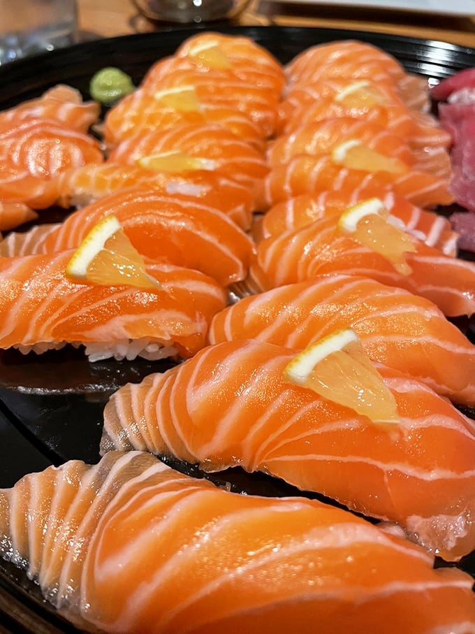 Salmon so vibrant it practically glows. These jewel-toned slices are what sushi dreams are made of—ocean freshness in every bite.