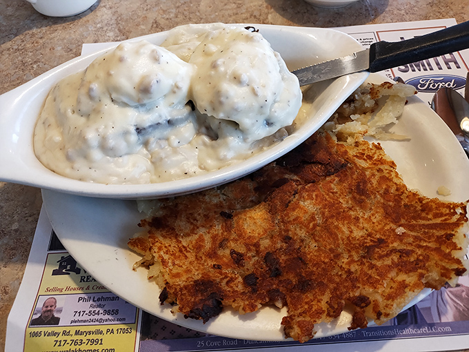 Scrapple and hash browns sharing a plate like old friends, with creamy gravy that could convert even the most skeptical diner.