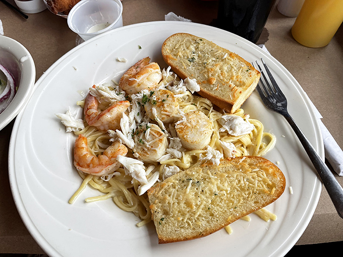 Seafood alfredo that doesn't skimp on the stars of the show – plump shrimp and sweet crab meat nestled in pasta that's worth every carb-laden bite.