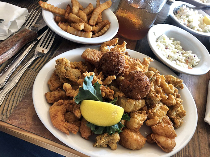 A seafood feast that makes you question why you ever wasted calories on lesser meals. The hushpuppies alone deserve their own fan club.