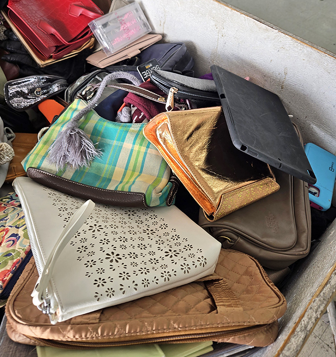 Designer handbags mingling with everyday purses in a democratic display of affordable luxury and practicality.