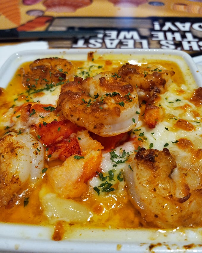 These shrimp aren't just sitting on the grits—they're having a flavor party and the cheese sauce got an exclusive invitation.