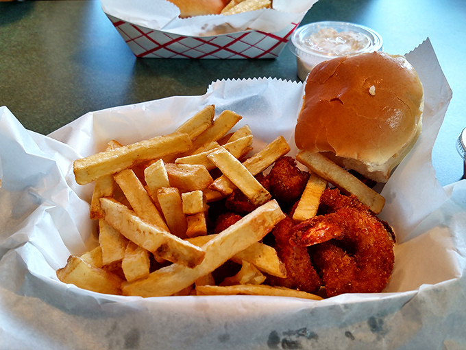 Shrimp and fries nestled in paper – no fancy plating needed when the food speaks this eloquently about simple pleasures.