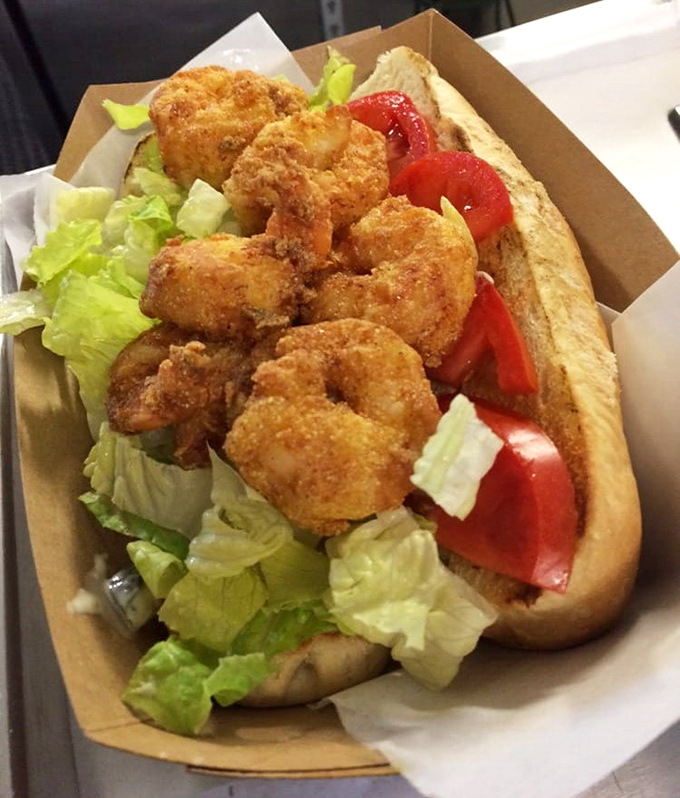 Plump, golden shrimp nestled in a fresh roll with crisp lettuce and tomato—a sandwich that whispers "Florida" in every bite.