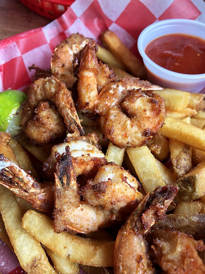 Golden-fried shrimp and crispy fries—the beach vacation equivalent of comfort food that makes you want to high-five the chef.