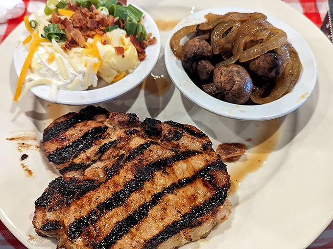 A perfectly grilled sirloin with those coveted crosshatch marks, flanked by loaded mashed potatoes and sautéed onions. Meat-lover's poetry on a plate.