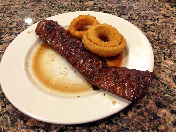 Skirt steak and onion rings – the Fred Astaire and Ginger Rogers of diner cuisine, dancing together in perfect harmony on a simple white plate.